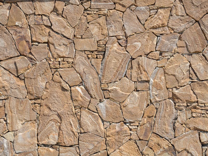 A Decorative Wall Made of Rough Stones of Various Shapes and Sizes ...