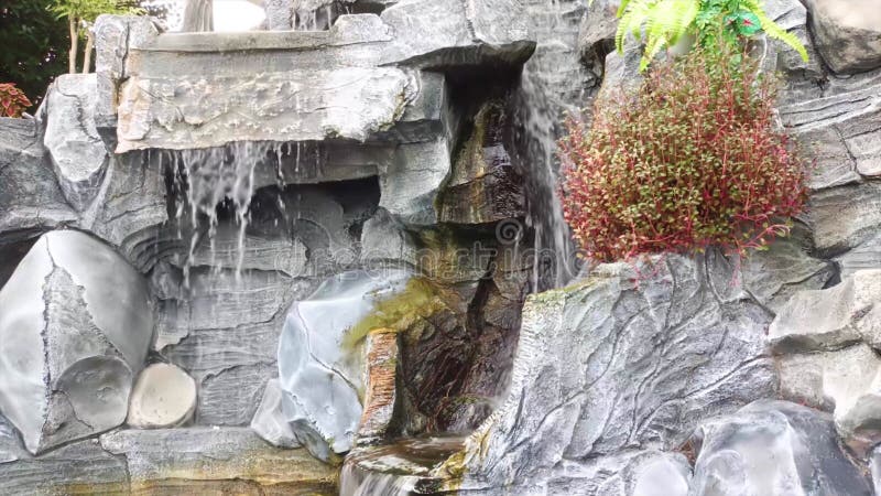 Decorative Waterfall with Artificial Concrete Wall and Plants Stock ...