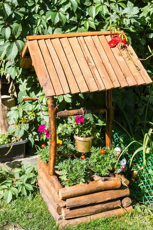 Decorative Well with Flowers Stock Image - Image of ground, building ...