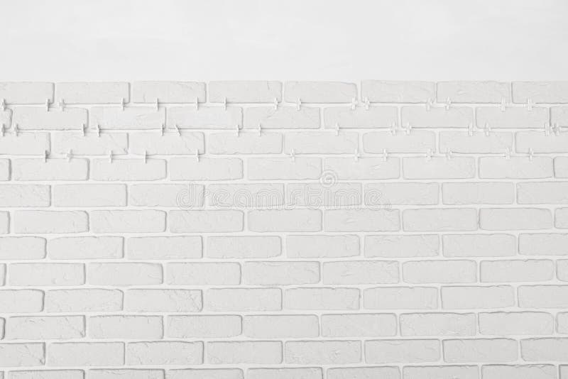 Decorative White Bricks with Tile Leveling System on Wall Stock Photo ...