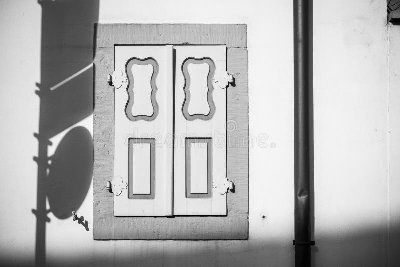 Decorative White Window Shutters Wit Cutout Patterns Stock Photo ...