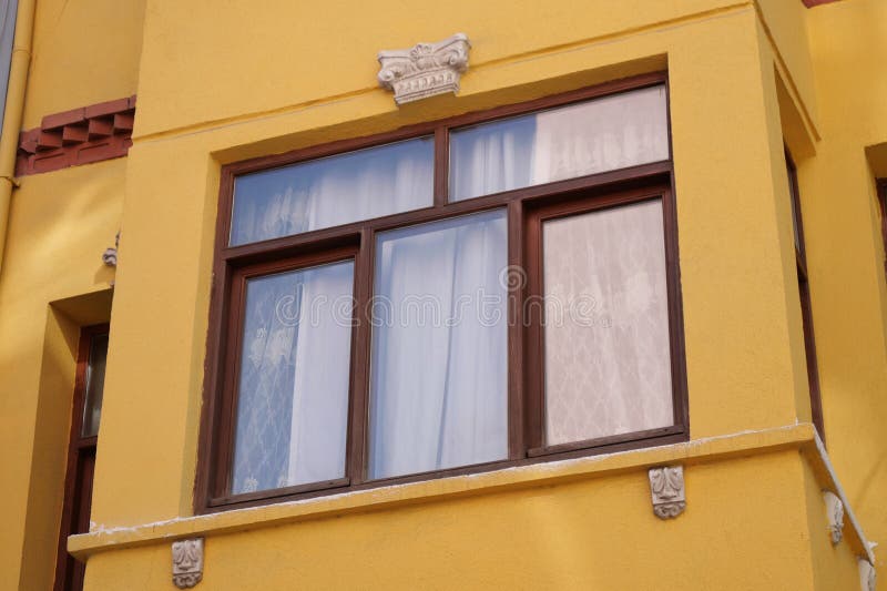 A Yellow Building with Balconies and Windows on the Side, AI Stock ...