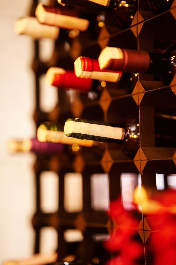 A Decorative Wine Rack Displaying Various Bottles Ready for Enjoyment ...