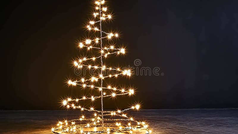 Decorative Wire Christmas Tree Illuminated with Bright Lights in a ...