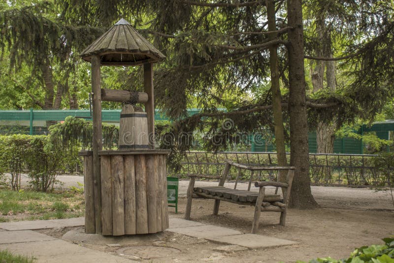 Decorative Wooden Well Standing in the Park. Stock Image - Image of ...