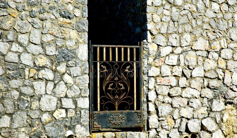Iron gate and wall stock photo. Image of architecture - 299030588