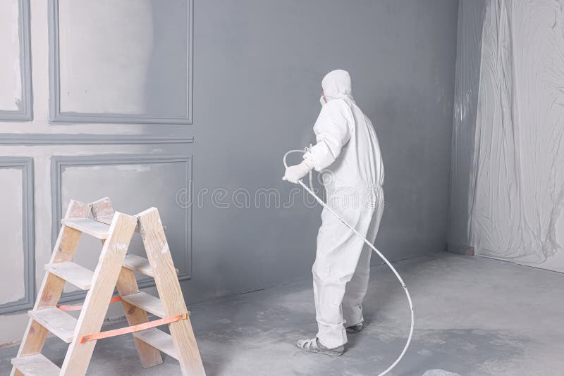 Decorator Dyeing Wall in Grey Color with Spray Paint Indoors, Back View ...