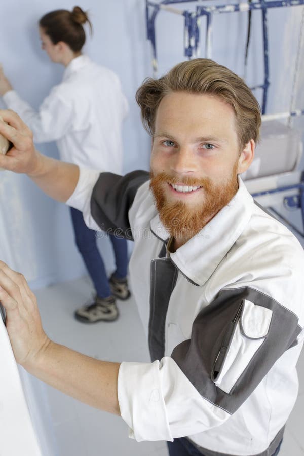 Decorator Preparing Wall for Repainting Stock Photo - Image of woman ...