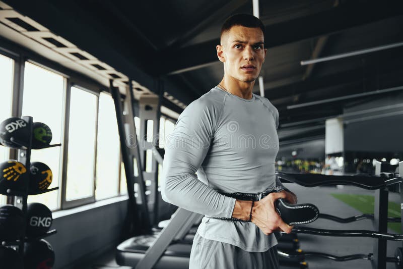 Dedicated Athlete Adjusts His Leather Gym Belt, Ensuring Proper Support ...