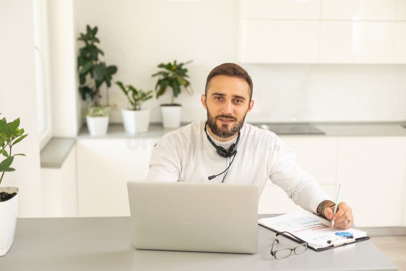 Dedicated Entrepreneur Sitting at Office Desk and Reading an E-mail ...