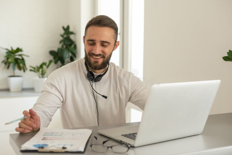 Dedicated Entrepreneur Sitting at Office Desk and Reading an E-mail ...