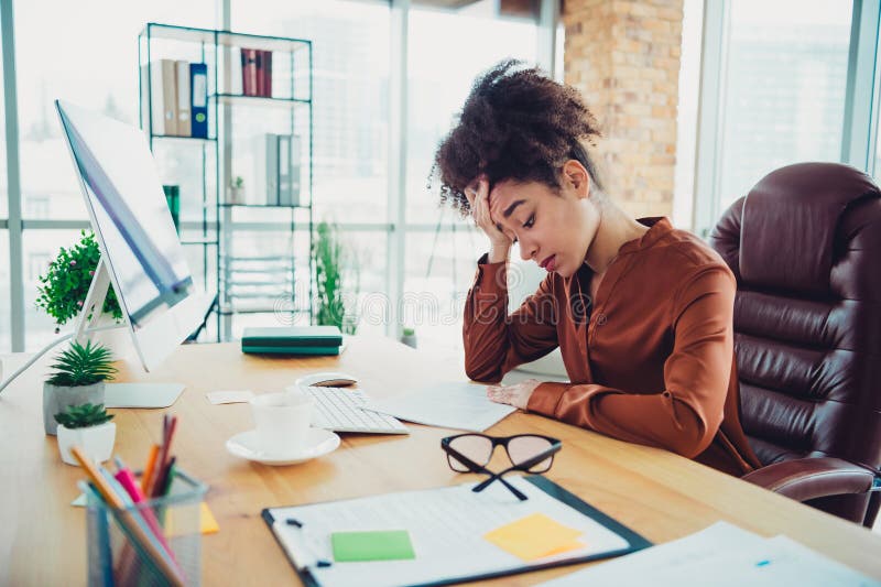 Stressed Young Businesswoman Working Overtime in a Modern Office with ...