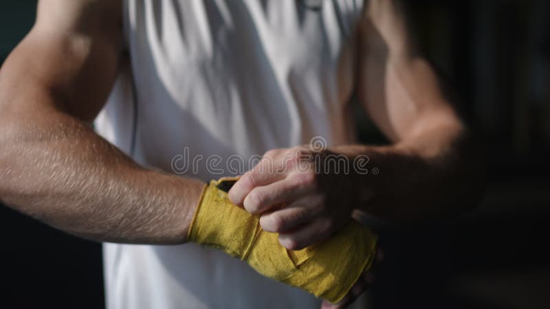 An Athlete Preparing with Hand Wraps for Intense Boxing Training and ...