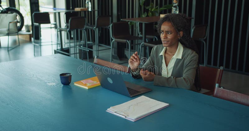 A Focused and Professional Individual at a Desk Engaged in Work on a Notebook Laptop Stock ...