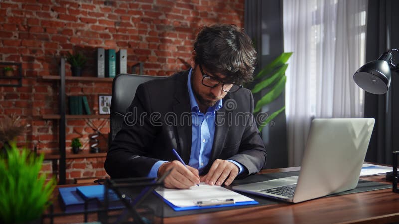 Focused Professional Writing Notes in Modern Office Stock Video - Video ...