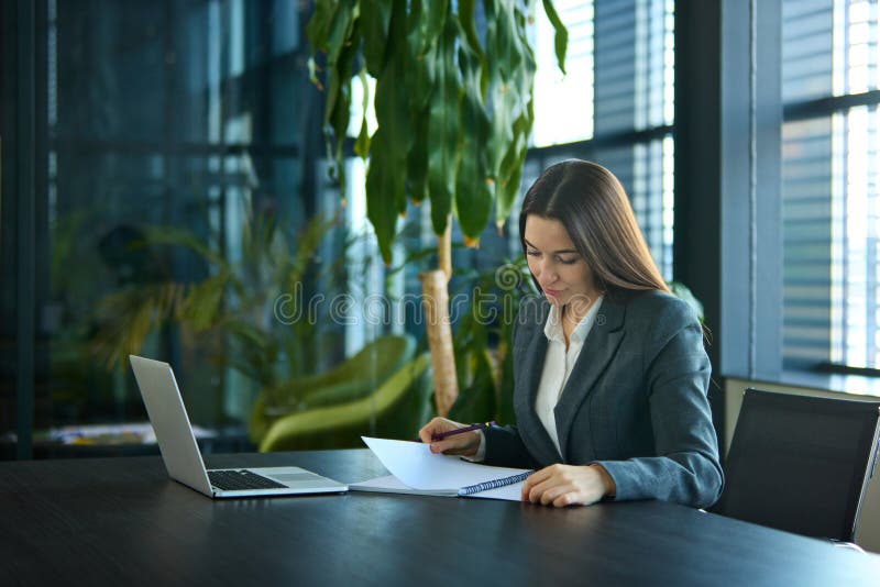 Dedicated Professional Writing in Notebook, Planning Tasks and Managing ...