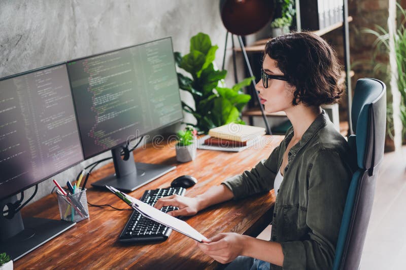 Young Female Programmer Working on Computer in Modern Workspace ...
