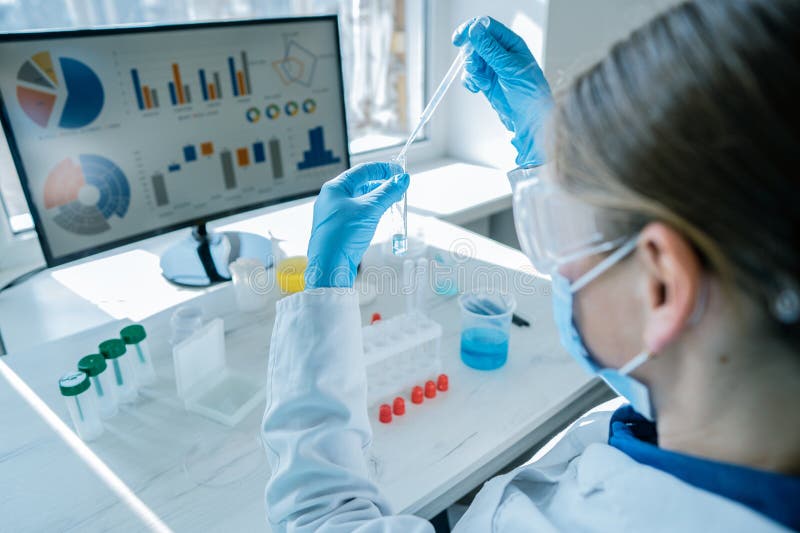 A Dedicated Scientist Conducts Important Lab Research, Using a Pipette ...