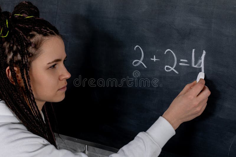A Dedicated Student Diligently Solving a Complex Math Equation on a ...