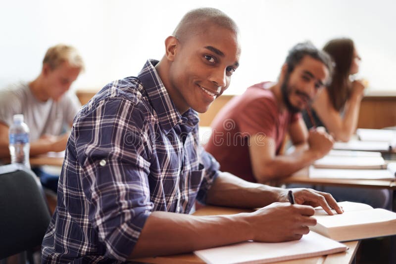 Dedicated To Education. a Young College Students in Class. Stock Image ...