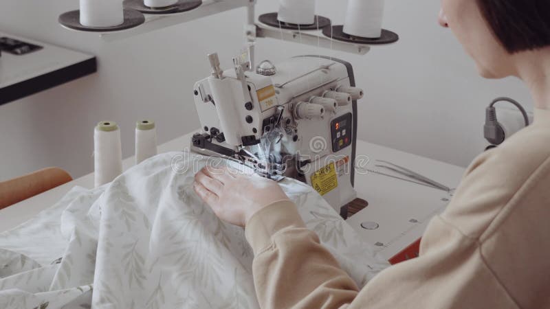 Female Tailor Working at Sewing Machine in Workshop Stock Video - Video ...