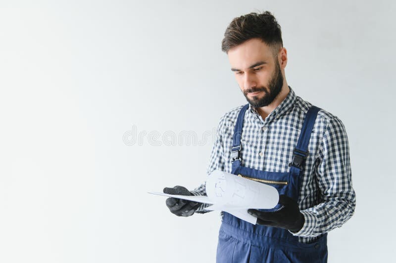 A Dedicated Worker Doing Calculations for Material for Apartment in ...