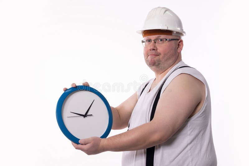 A Dedicated Worker is Holding a Clock while Wearing a Construction ...