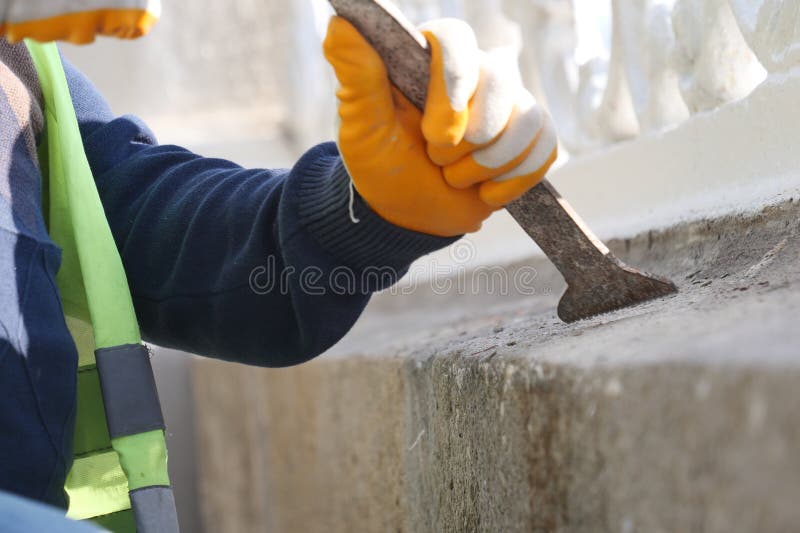 A Dedicated Worker Meticulously Restoring a Wall Using Various Tools ...