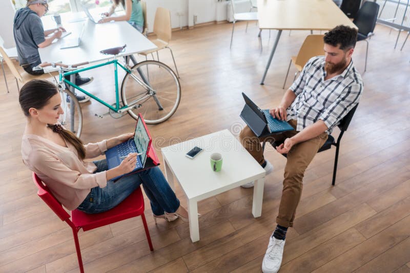 Dedicated Young Woman Editing a Document in a Modern Office Space Stock ...