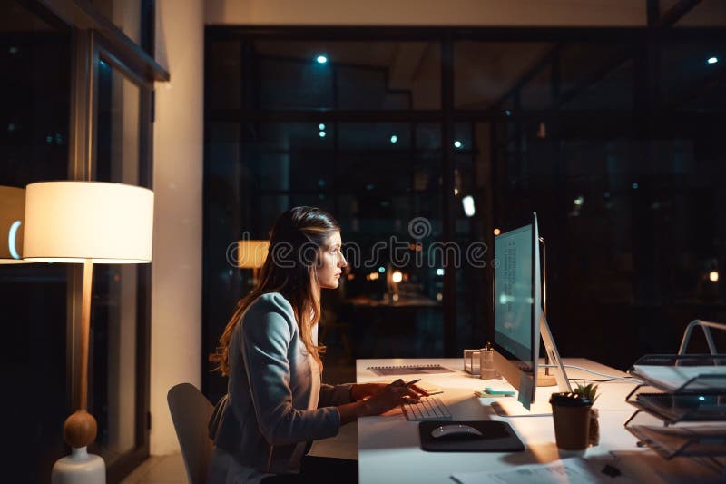 Dedication Gets Things Done. a Young Businesswoman Using a Computer ...