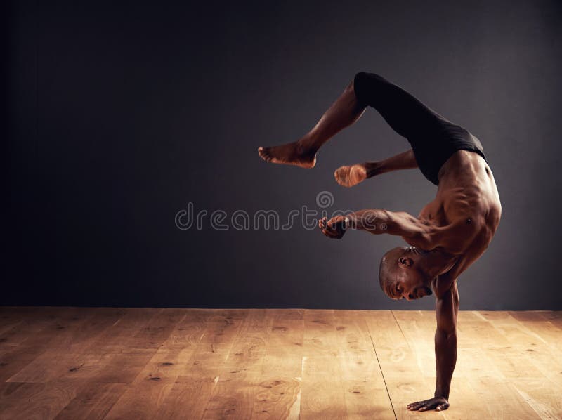 Dedication, Passion, Commitment. Male Dancer Performing an Acrobat Move ...