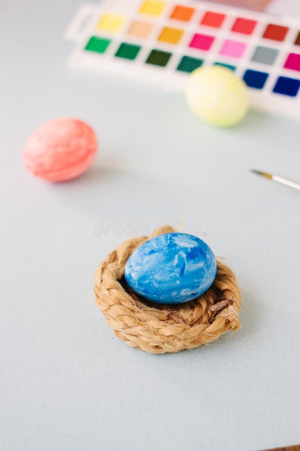 Deep Blue Easter Egg on Nest Over Bright Background. Stock Image ...