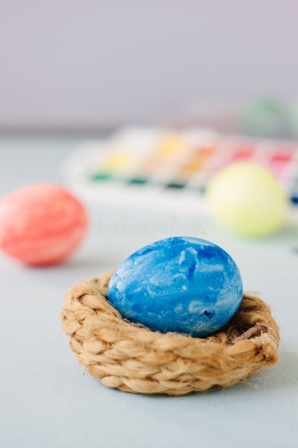 Deep Blue Easter Egg on Nest Over Bright Background. Stock Photo ...