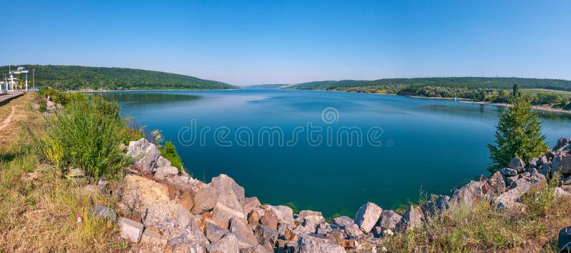 Deep Blue Lake Against the Backdrop of Gently Sloping Green Ridges ...