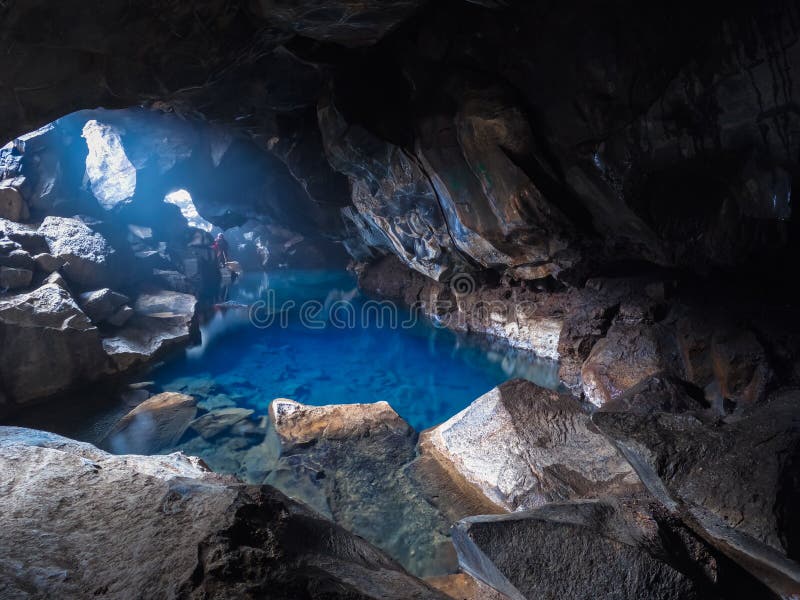 Deep Blue Lake Inside the Cave with Photographer Stock Image - Image of ...