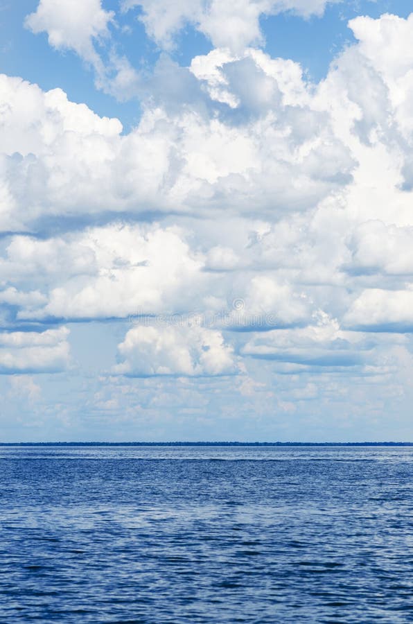 Deep Blue Open Lake with Clouds in Sky Stock Photo - Image of vertical ...