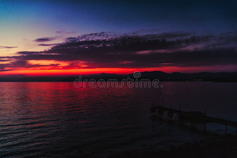 Deep Blue Red Sunset Over the Sea Stock Image - Image of cloud, pier ...