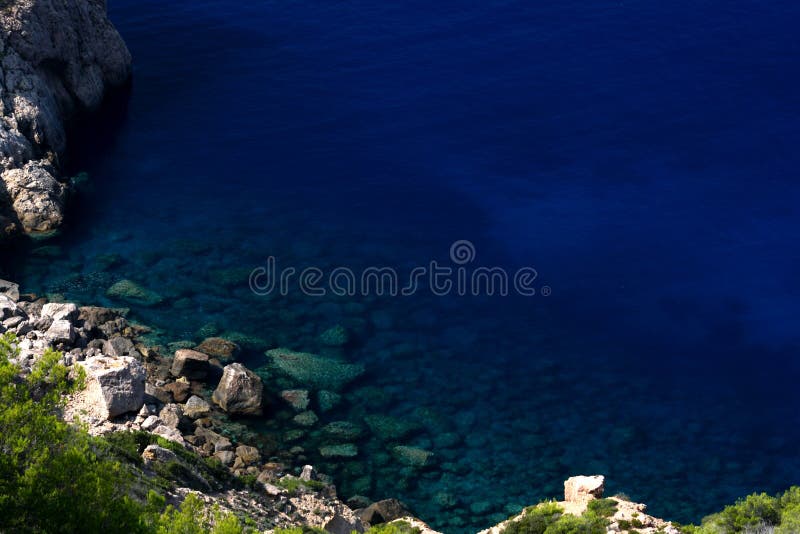 Deep blue sea and rocks stock image. Image of beach, blue - 26708171