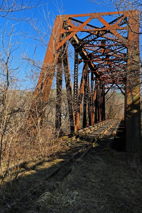 Deep Blue Skies Over a Rusted Train Bridge Stock Photo - Image of ...