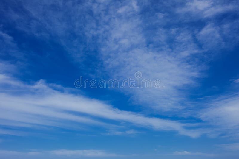 A Deep Blue Sky with Light White Clouds Background Stock Image - Image ...