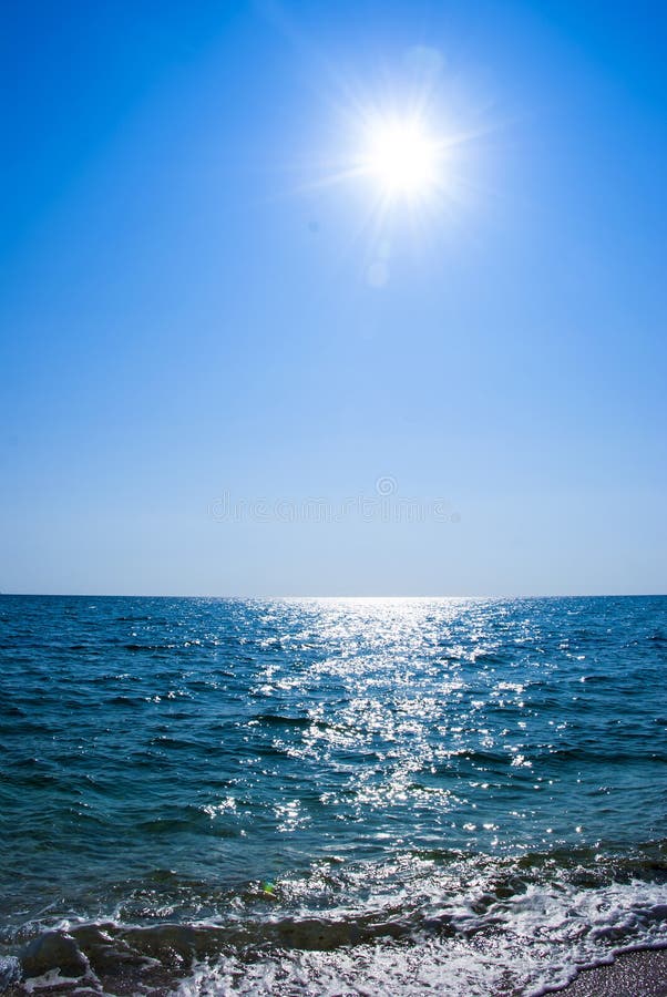 Deep Blue Water with Sun Reflection and Sparks on the Surface Stock ...