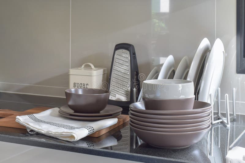 Deep Brown Ceramic Set on Black Granite Top Counter Stock Photo - Image ...