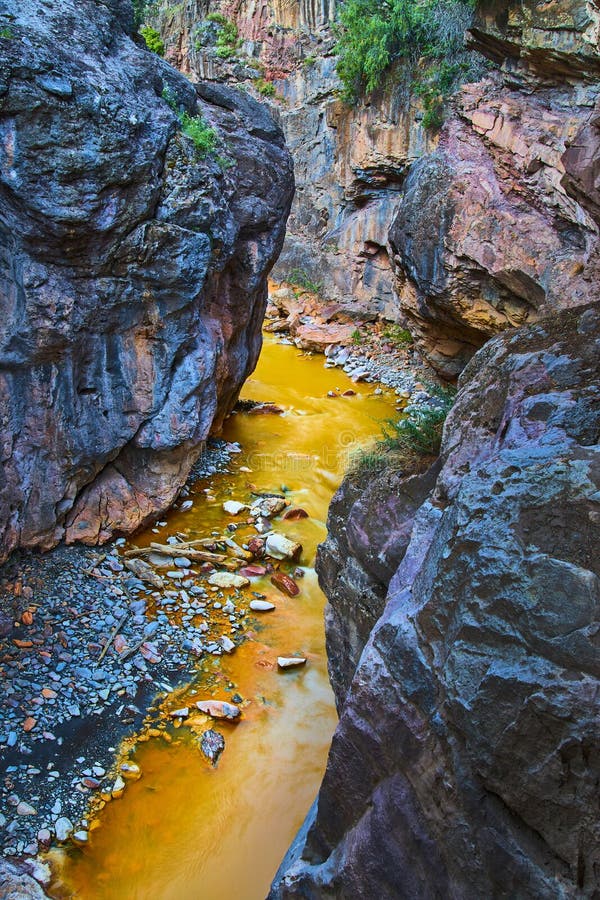 Deep Canyon of Large Colorful Rocks and Yellow River Water Stock Image ...
