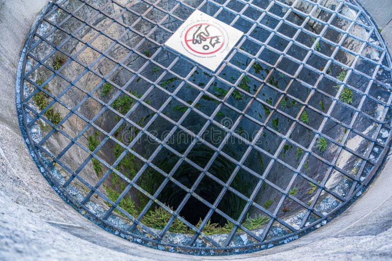 Deep Circular Well Covered with a Metal Grid Stock Image - Image of ...