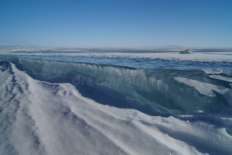 A Deep Crack in the Shiny Smooth Surface of the Ice Stock Image - Image ...