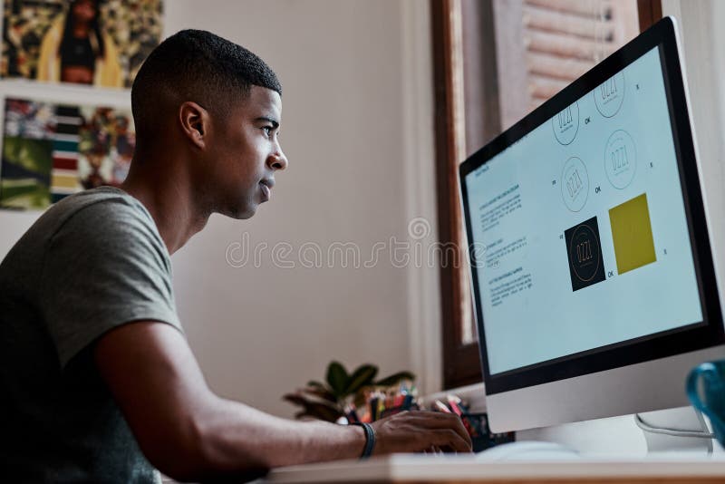 Deep in the Creative Zone. a Young Businessman Using a Computer in a ...