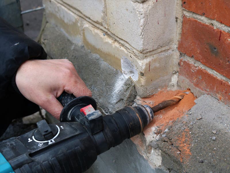 Deep Drilling of the Outer Wall of the Building Stock Image - Image of ...