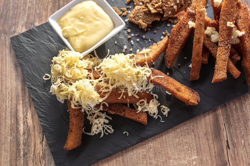Deep Fried Black Rye Bread with Cheese Salt and Spices, on a Plate ...