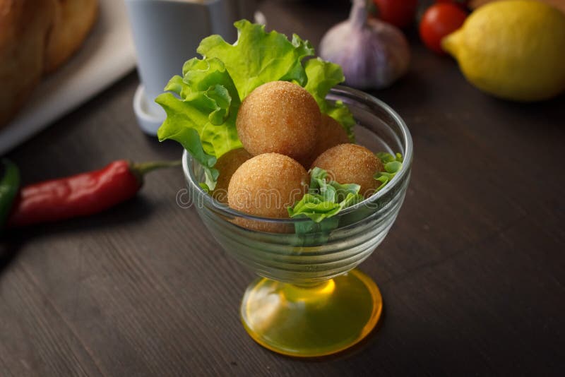 Deep Fried Cheese Balls, Homemade Apetizer with Lettuce Leaves Stock ...