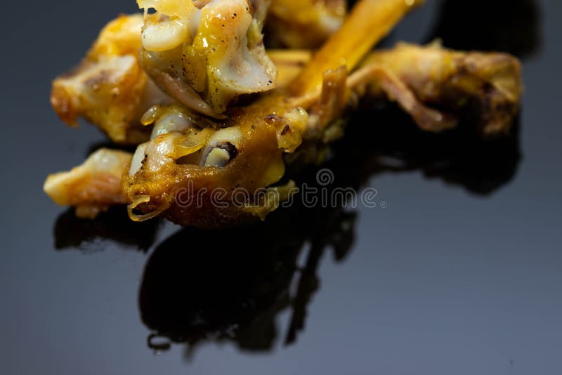 Deep Fried Chicken Bones on Shiny Dark Surface Stock Image - Image of ...